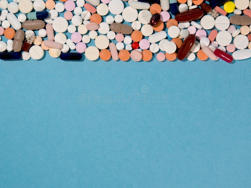 Group of Pharmaceutical Medicine Pills, Tablets and Capsules on a Blue ...