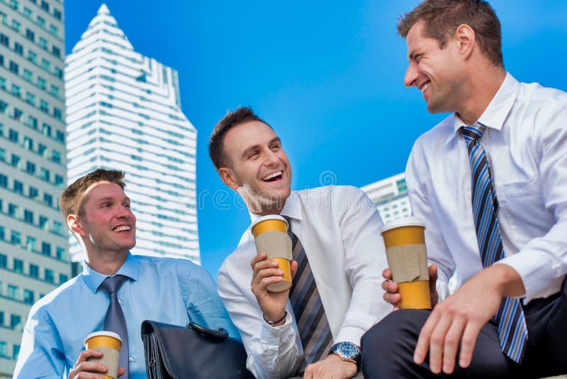 Group Photo of Colleagues Sitting and Talking while Drinking Coffee ...