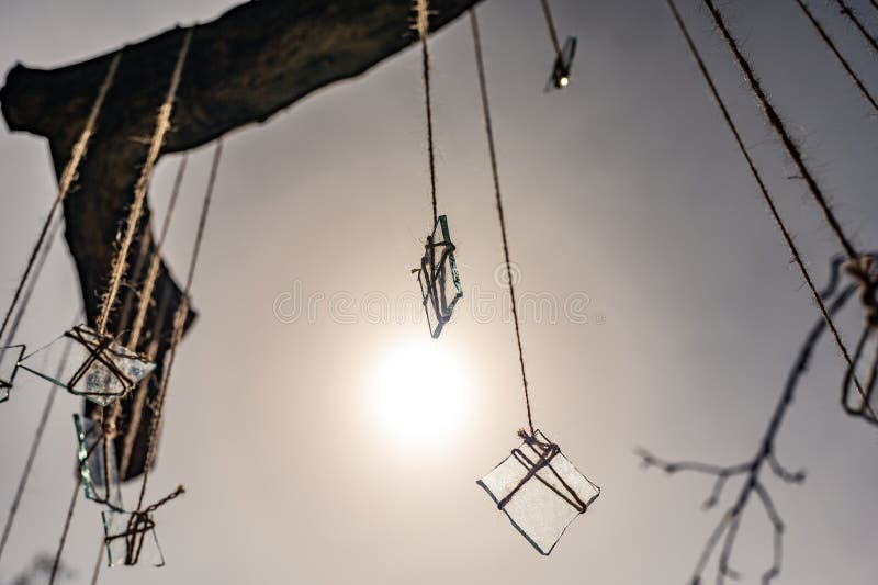 Group of Pieces of the Glass on the Strings in Front of the Sun with ...