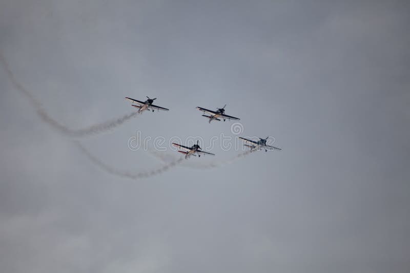 Group of 4 Planes Flying in Formation, Doing Aerobatic Demonstrations ...