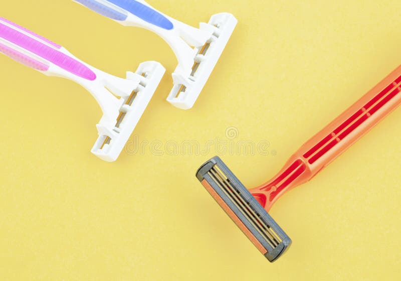 The Group of Plastic, Disposable Razors on Yellow Background Stock ...