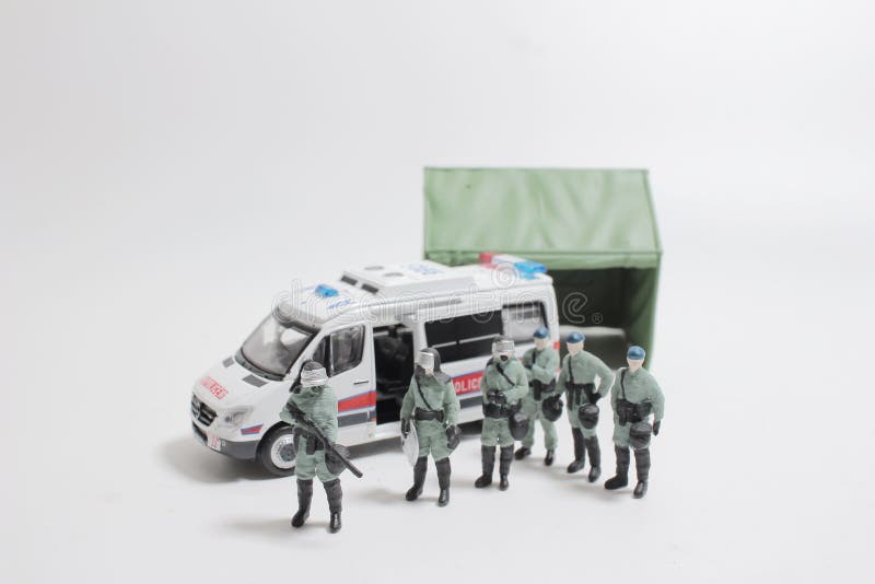 A Group of Police Figure with Car on Board Stock Image - Image of ...