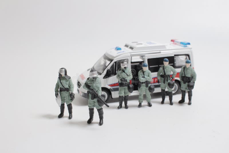 A Group of Police Figure with Car on Board Stock Image - Image of ...