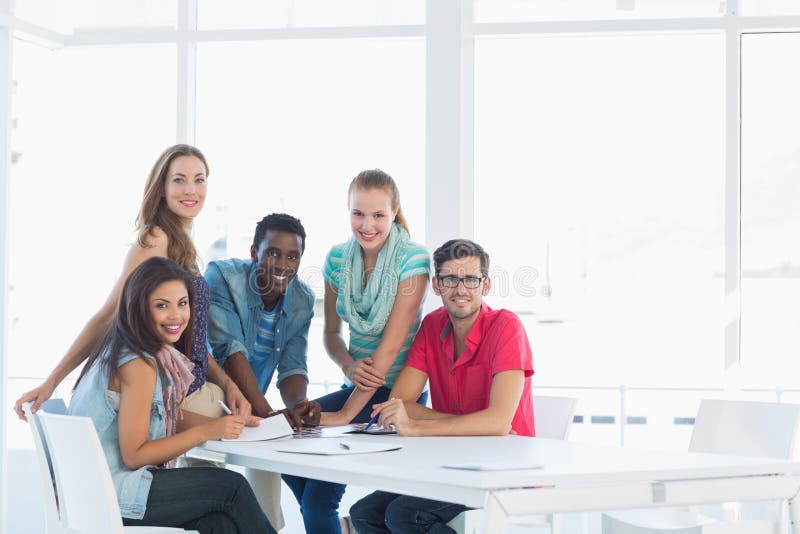 Group Portrait of Casual Artists Working on Designs Stock Image - Image ...