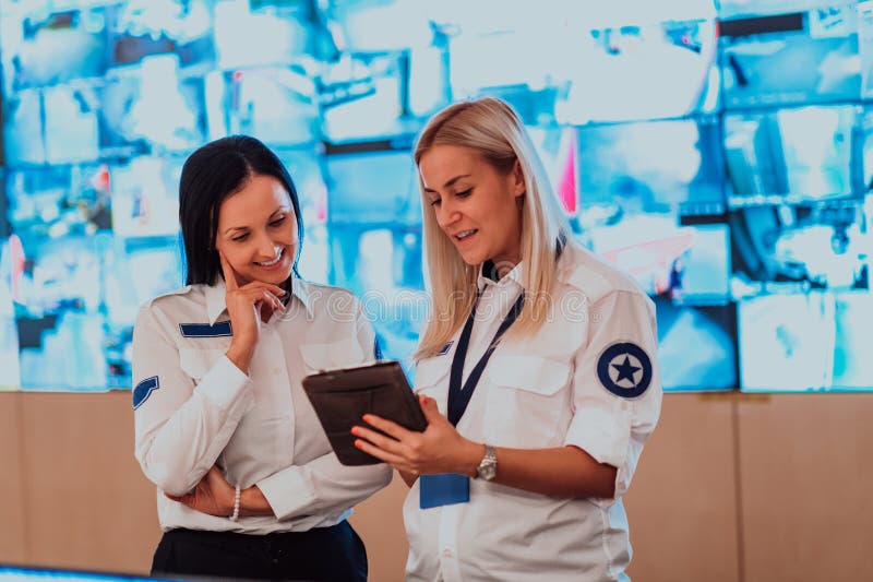 Female Security Operator Working in a Data System Control Room Offices ...