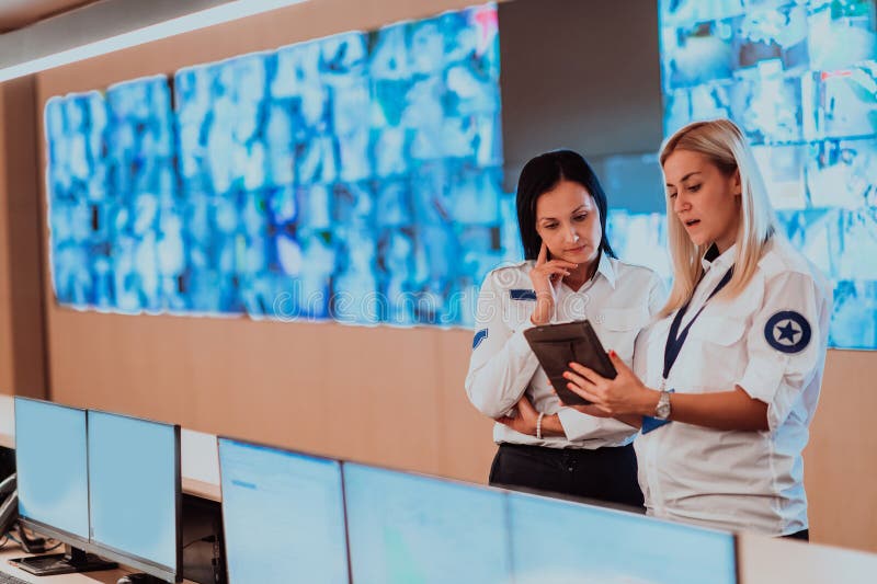 Female Security Operator Working in a Data System Control Room Offices ...