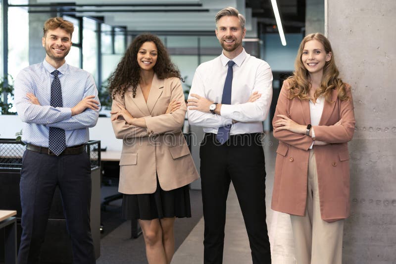 Group Portrait of a Professional Business Team Looking Confidently at ...