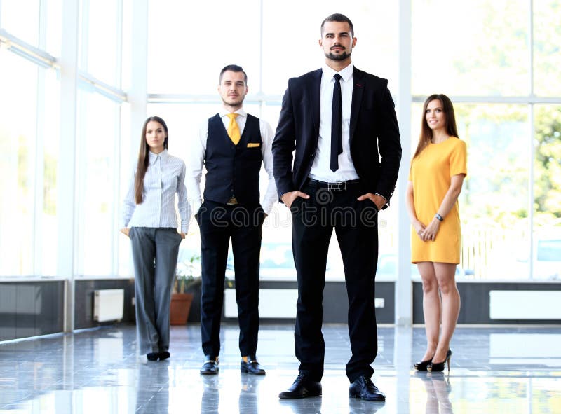 Group Portrait of a Professional Business Team Looking Confidently ...