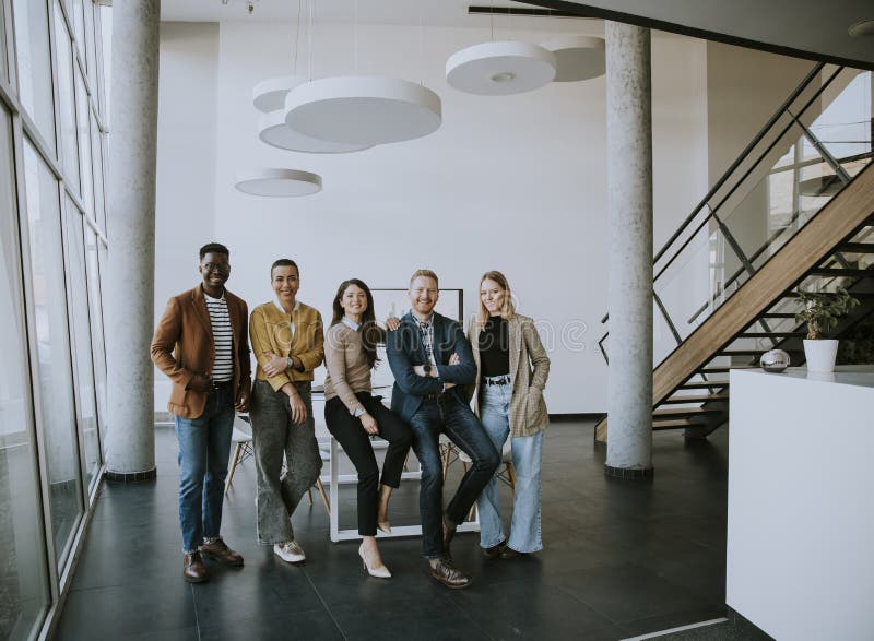 Group of Positive Businesspeople Standing Together in the Office Stock ...