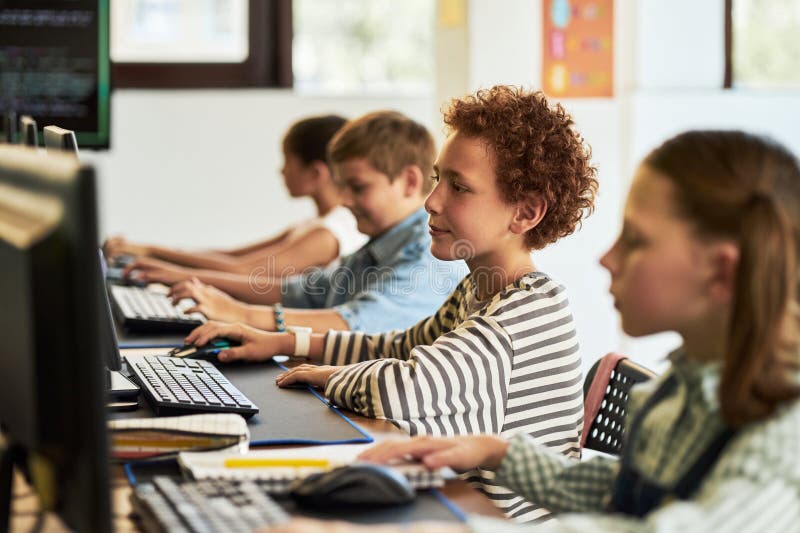 Group of Preteen Children Using Desktop Computers during Coding Lesson ...