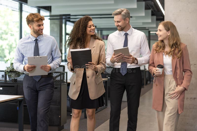 Group of a Professional Business Team Walking and Discussing in ...