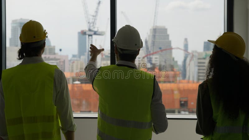 Group of Professional Civil Engineers Team Working on New Building ...