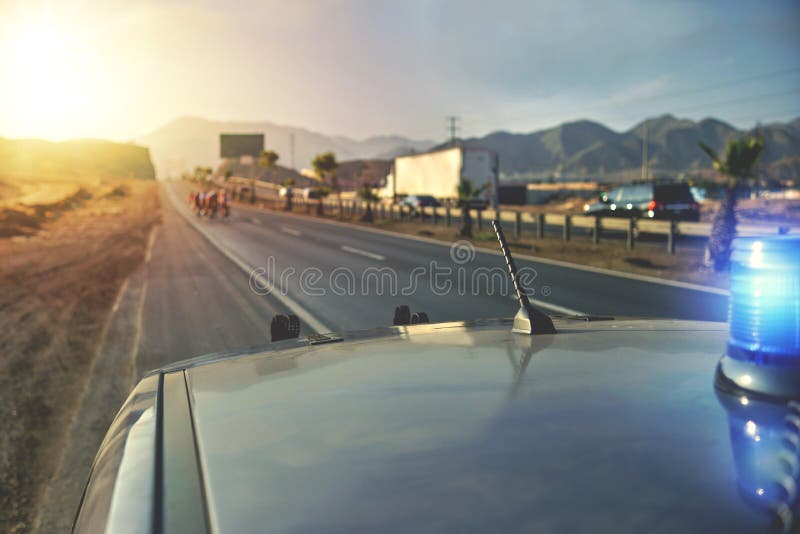 Group of Professional Cyclists Training on Highway with Safety Escort ...
