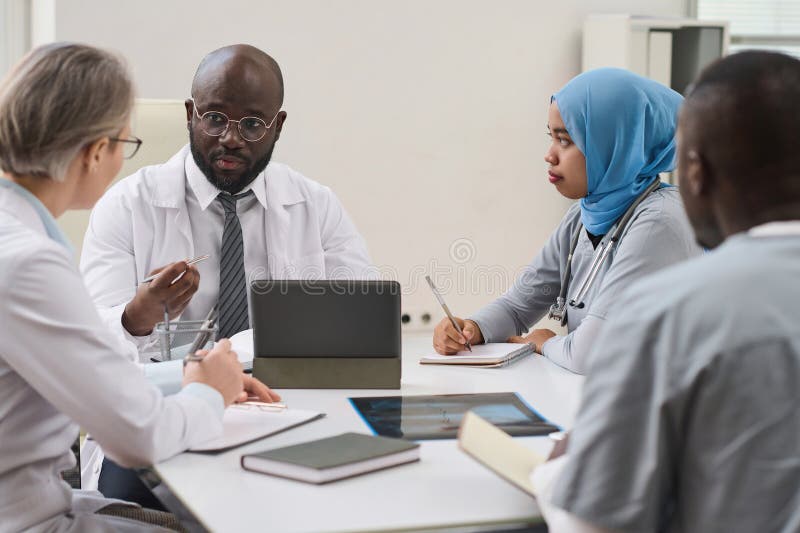 Teamwork of Doctors during a Meeting in Office Stock Image - Image of ...