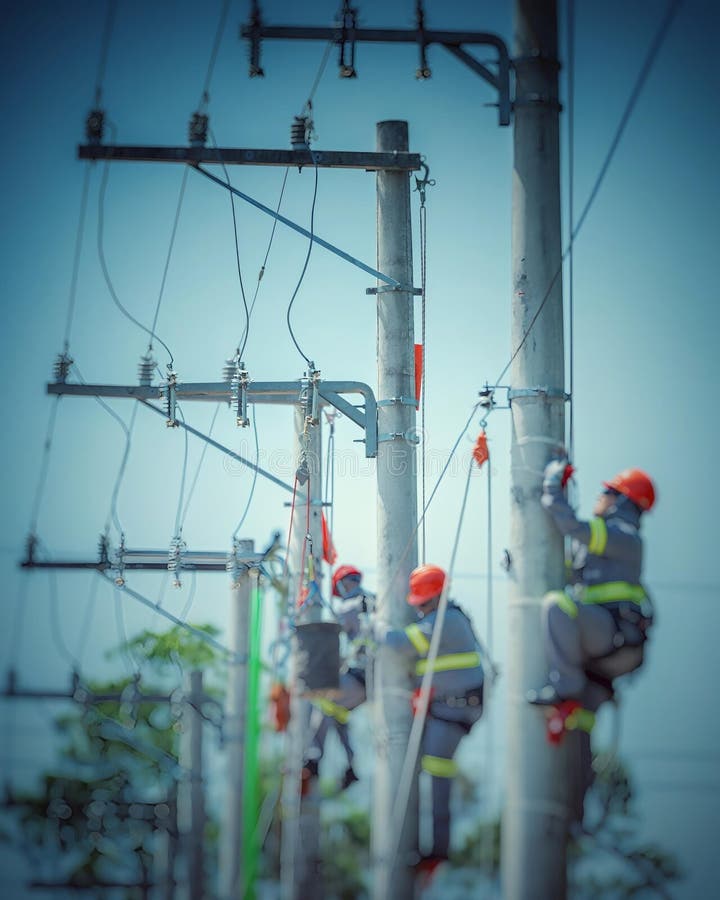 Group of Professional Electrical Linemen Performing Maintenance and ...