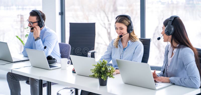 Group of Professional Help Desk Representatives Working in Call Center ...