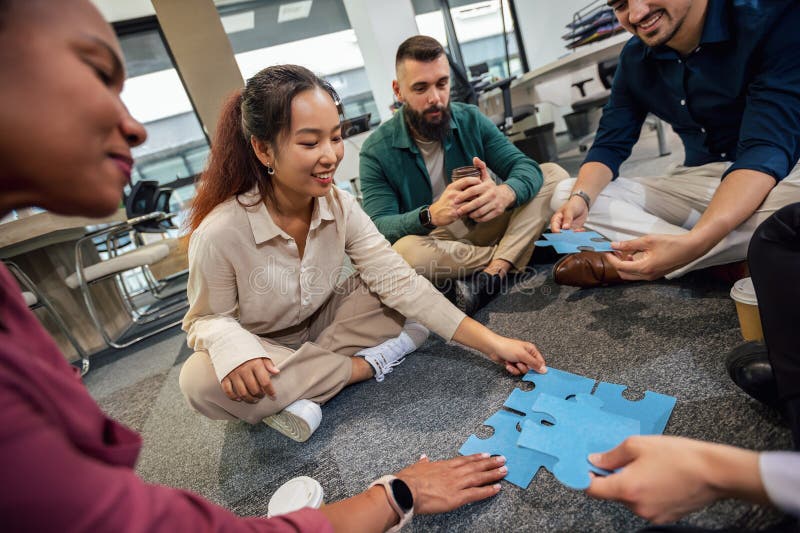 Group of Professional People Playing Puzzle in the Office Stock Photo ...