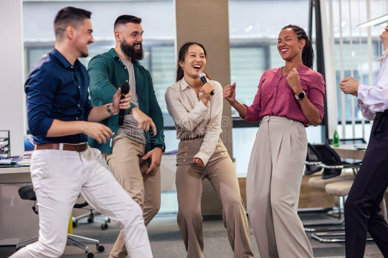 Professional People Singing Karaoke in the Modern Office Stock Image ...