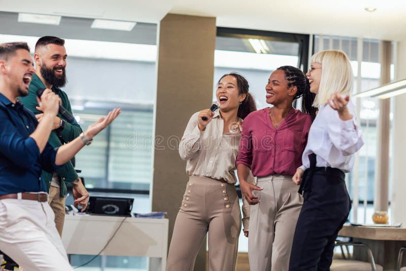 Professional People Singing Karaoke in the Modern Office Stock Image ...