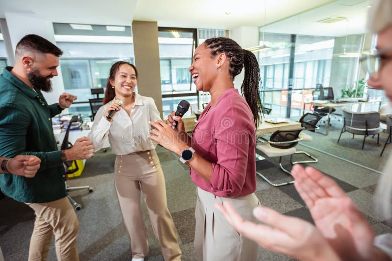 Professional People Singing Karaoke in the Modern Office Stock Photo ...