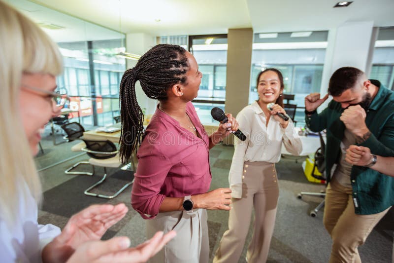 Professional People Singing Karaoke in the Modern Office Stock Image ...