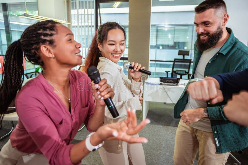Professional People Singing Karaoke in the Modern Office Stock Photo ...
