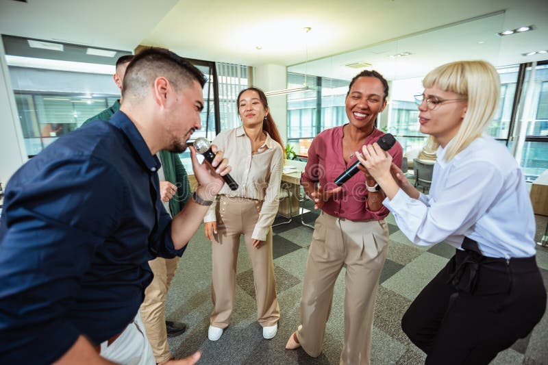 Professional People Singing Karaoke in the Modern Office Stock Image ...