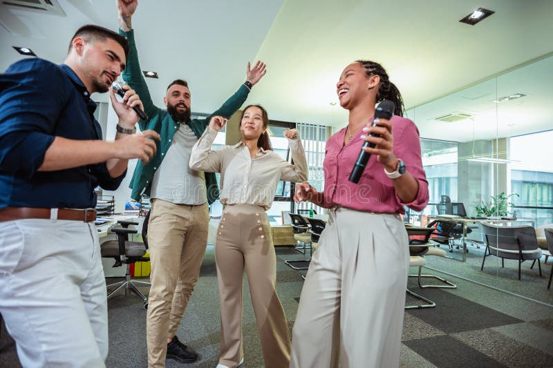 Professional People Singing Karaoke in the Modern Office Stock Photo ...