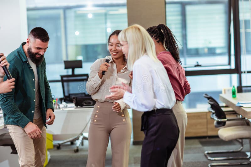 Professional People Singing Karaoke in the Modern Office Stock Image ...