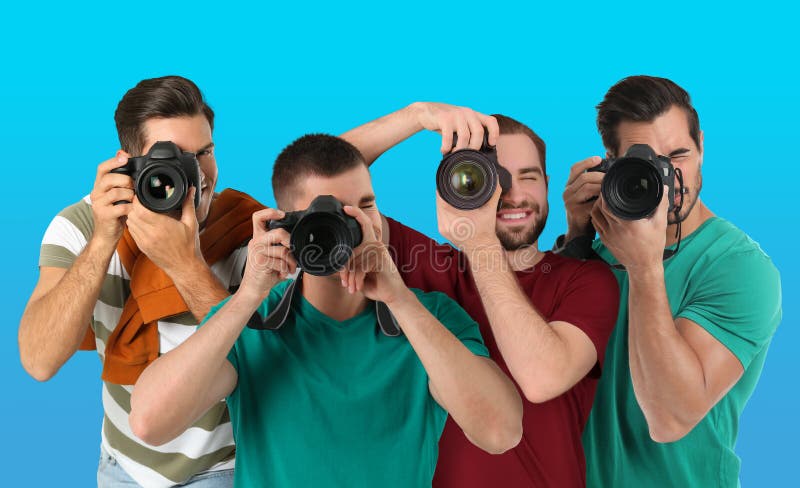 Group of Professional Photographers with Cameras on Turquoise ...