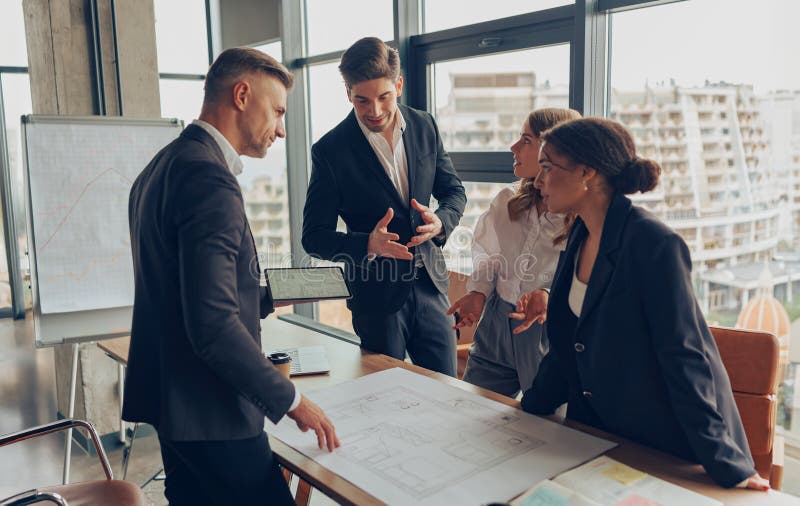 Group of Professional Team Design Engineers Working with Project ...