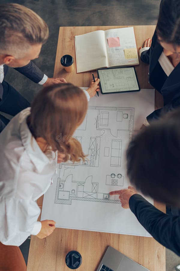 Group of Professional Business Managers Working with Project Documents ...