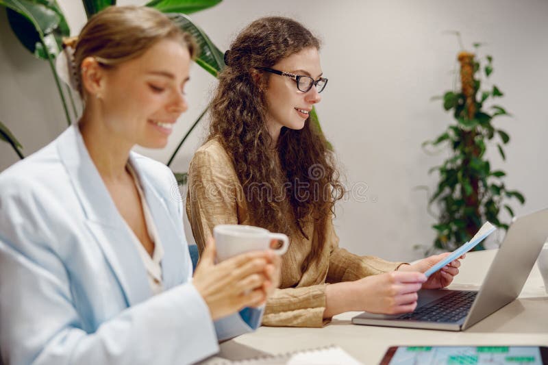 A Group of Professional Women Collaborating Effectively in a Modern ...