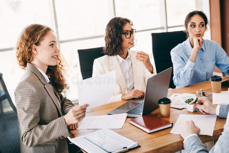 Group of Professionals Collaborating during a Business Meeting in a ...