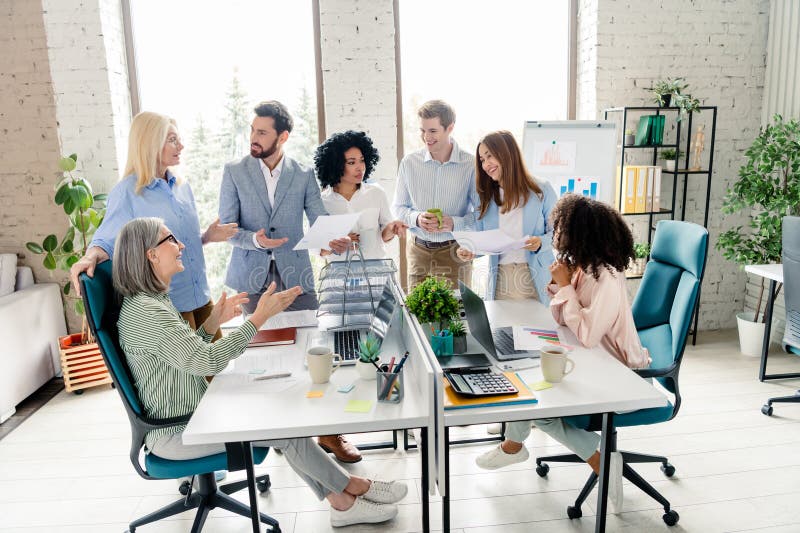 Group of Professionals Collaborating in Modern Office Workspace during ...