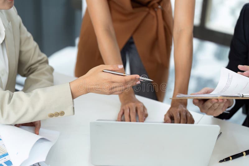 Collaborative Meeting. Professionals Discussing Over Documents and ...