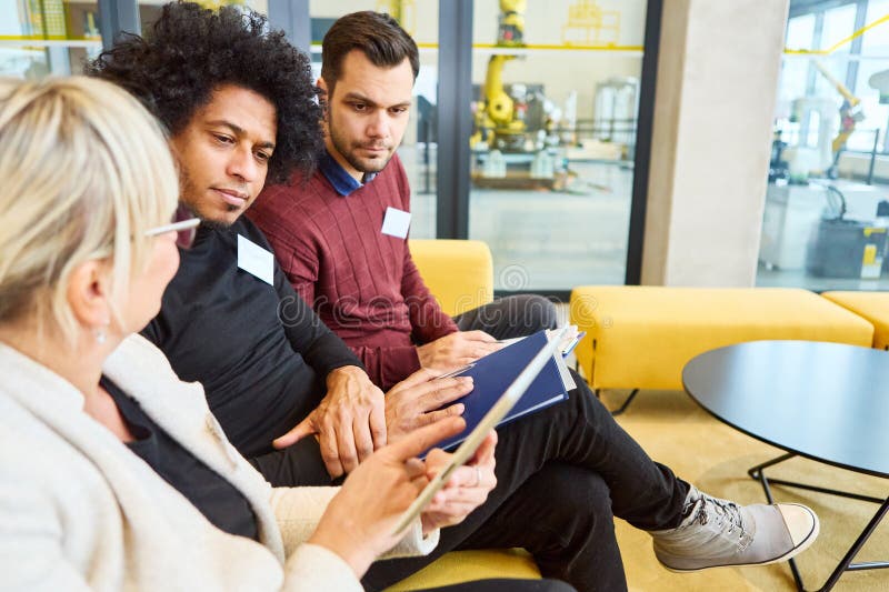 Group of Professionals Discussing Robotics and Process Automation in ...