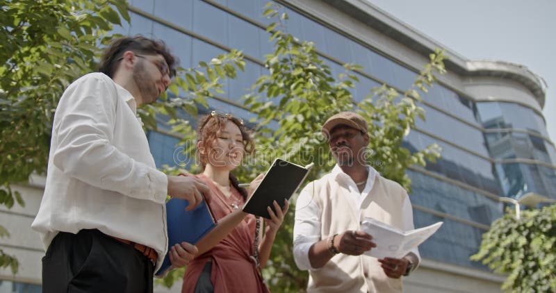 Group of Professionals Engaging in a Discussion about a Project ...