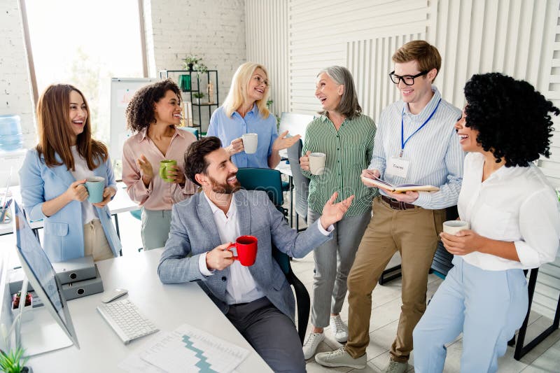 Group of Professionals Engaging in a Cheerful Conversation within an ...