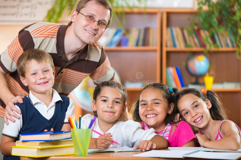 Group of Pupils in Classroom with Teacher Stock Photo - Image of ... Group of Pupils in Classroom with Teacher Stock Photo - Image of ...