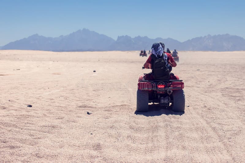 A Group of Quad Bikes Drive in the Desert Editorial Photography - Image ...