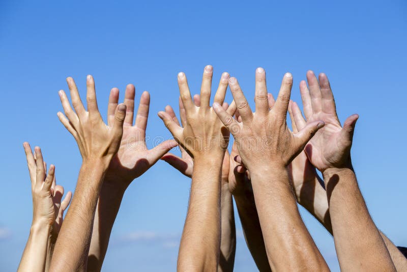 Group Raising Hands Against Blue Sky Background Stock Photo - Image of ...