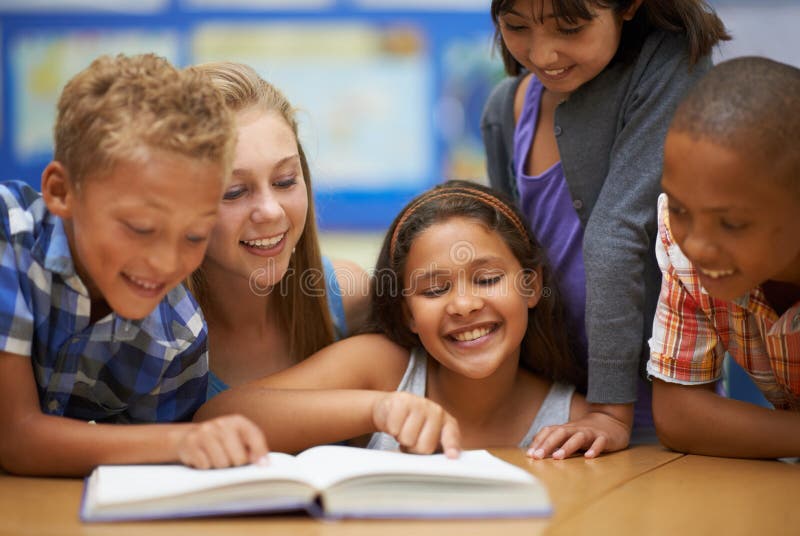 Group Reading in English Class. a Group of Pupils Reading from a Book ...