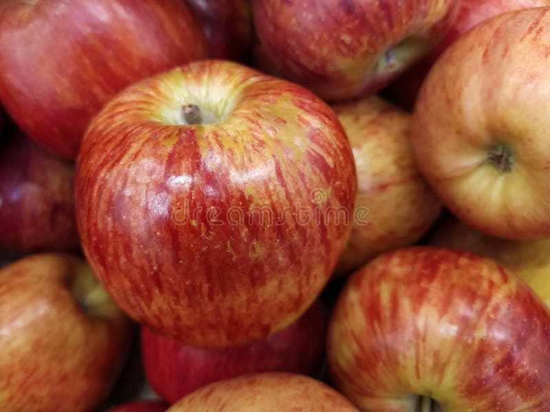 Group of Red Apples with Their Leaves Stock Photo - Image of divided ...