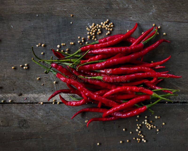 Group of Red Chilli. Isolated on Wooden Texture Background Stock Image ...
