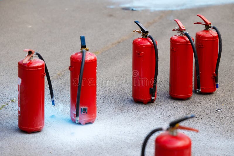 Group of Red Fire Extinguisher Containers Stock Photo - Image of ...