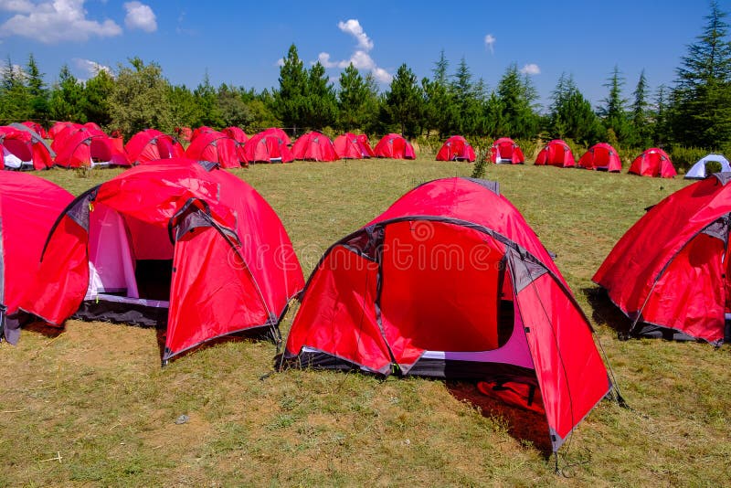 Group of Red Tents for Campers at Forest Stock Image - Image of blue ...