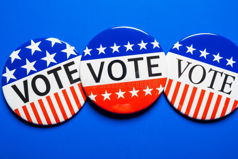 A Group of Red, White and Blue VOTE Button on a Blue Background Stock ...