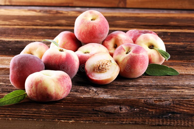 A Group of Ripe Peaches on Wooden Table Stock Image - Image of ...