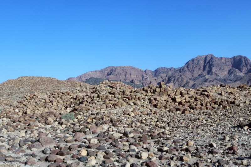 A Group of Rock Surrounded Mountains Stock Image - Image of blue ...